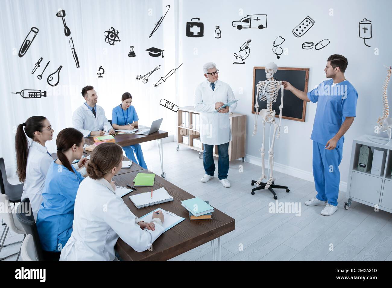 Medical students and professor studying human skeleton anatomy in ...