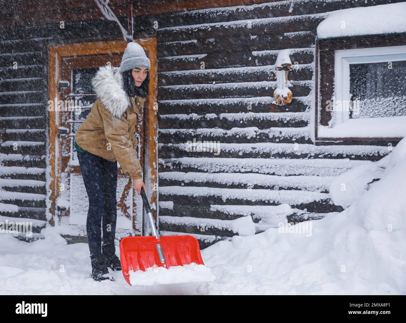 Woman shoveling deep snow hi-res stock photography and images - Alamy