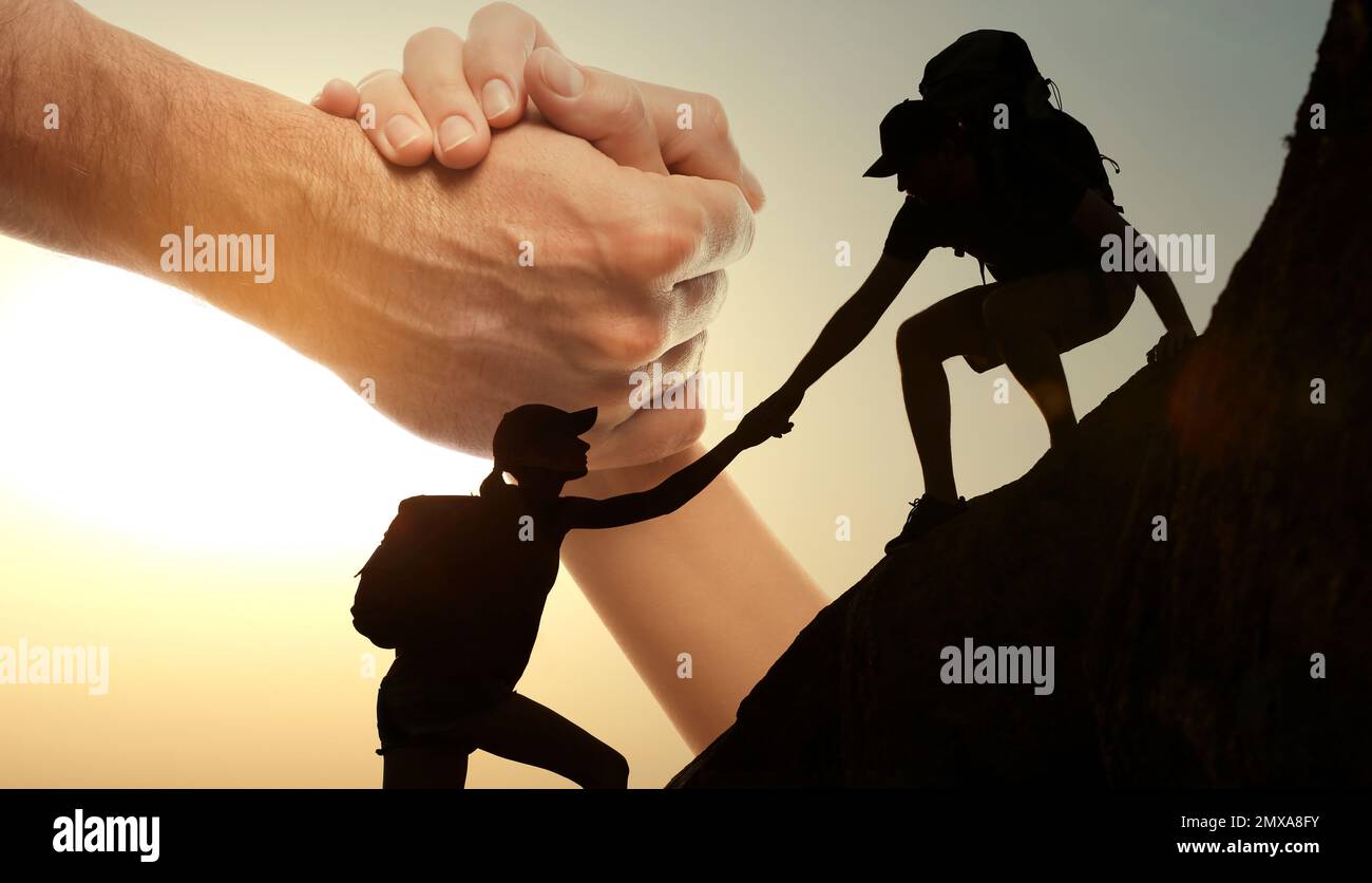 Helping hand mountain climbing hi-res stock photography and images - Alamy