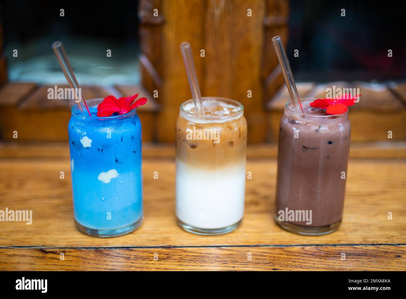 delicious milkshakes on the bar counter in a glass jar with a straw ...