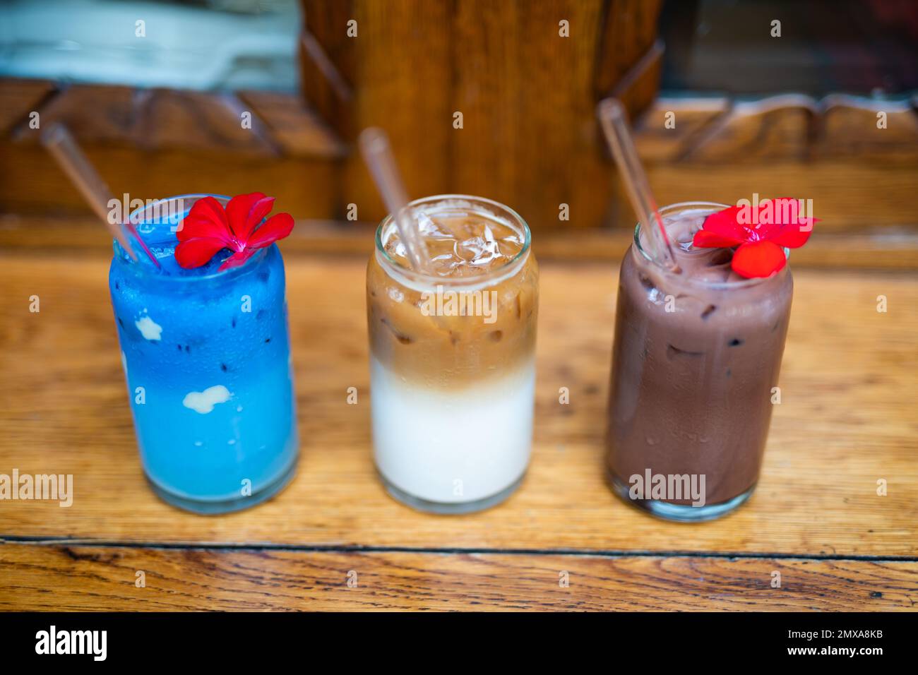 delicious milkshakes on the bar counter in a glass jar with a straw ...