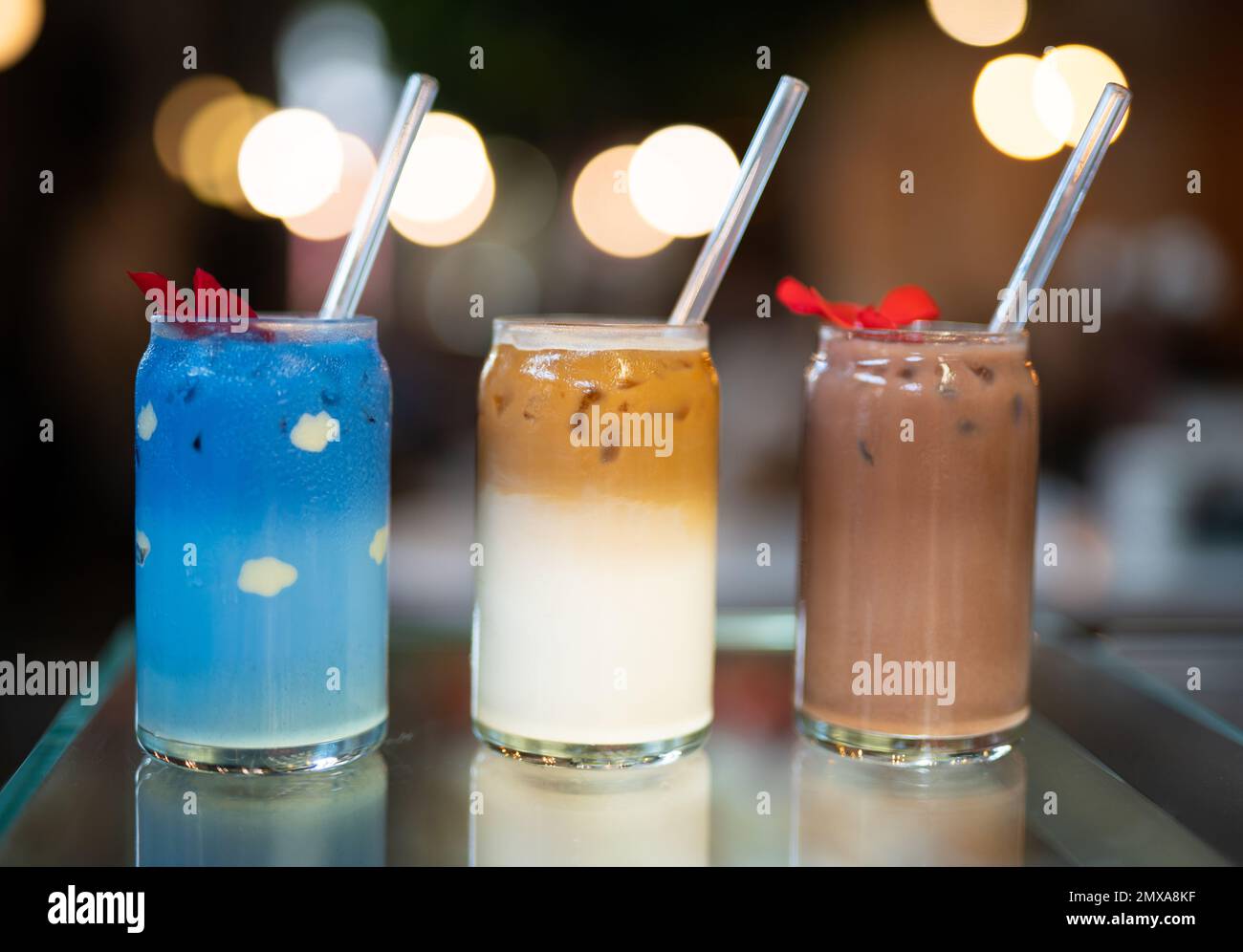 delicious milkshakes on the bar counter in a glass jar with a straw ...