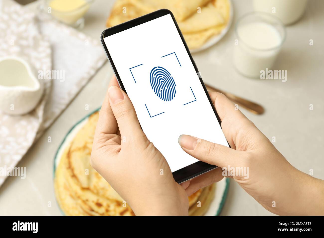 Woman scanning fingerprint on smartphone indoors, closeup. Digital ...