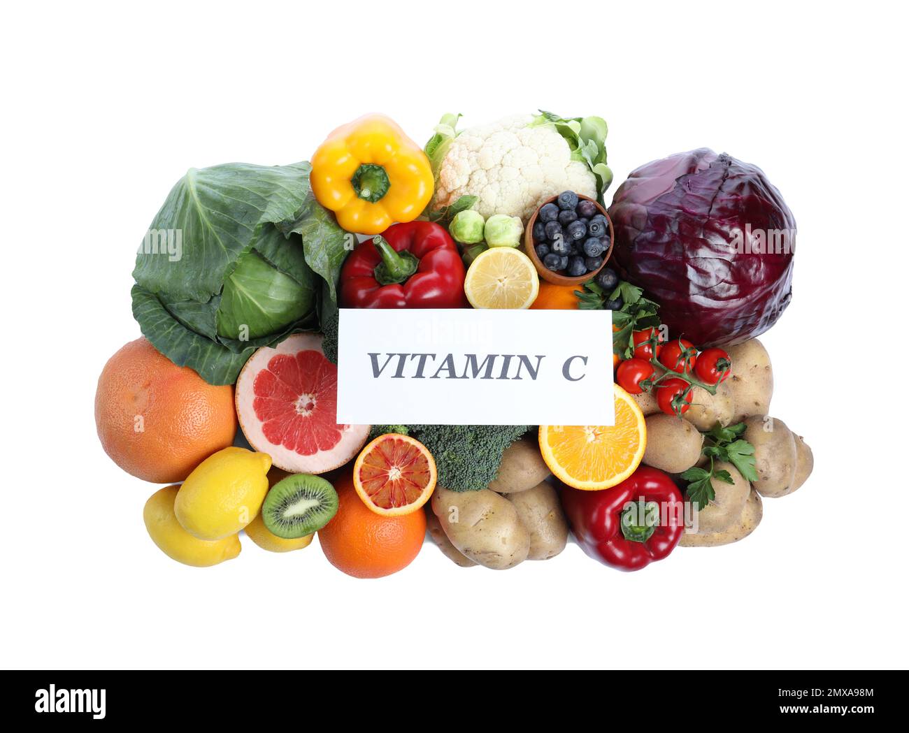 Paper note with phrase VITAMIN C and fresh products on white background ...