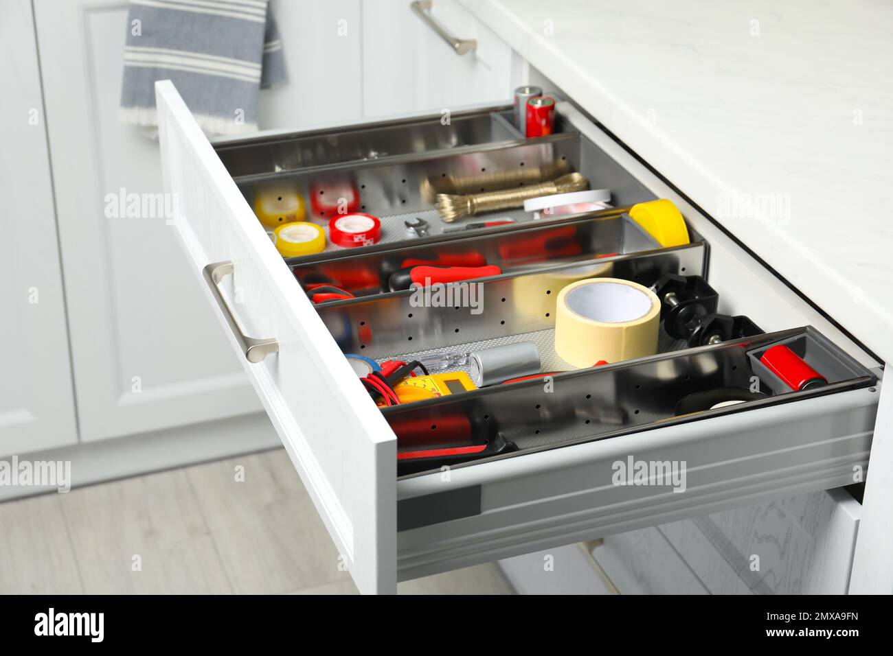 Set of instruments in open desk drawer indoors Stock Photo - Alamy