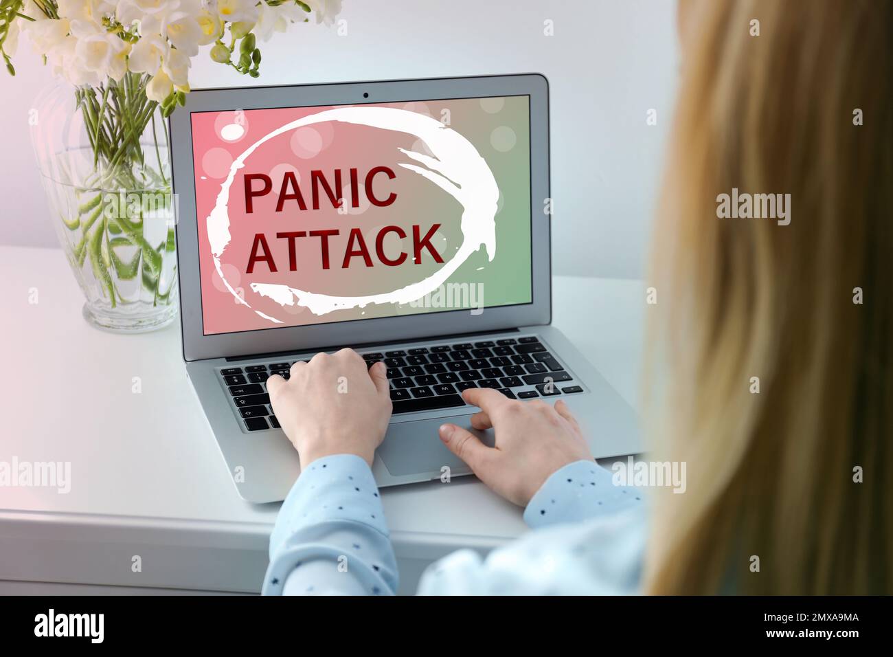 Woman working with laptop at home. Use information safely to avoid ...