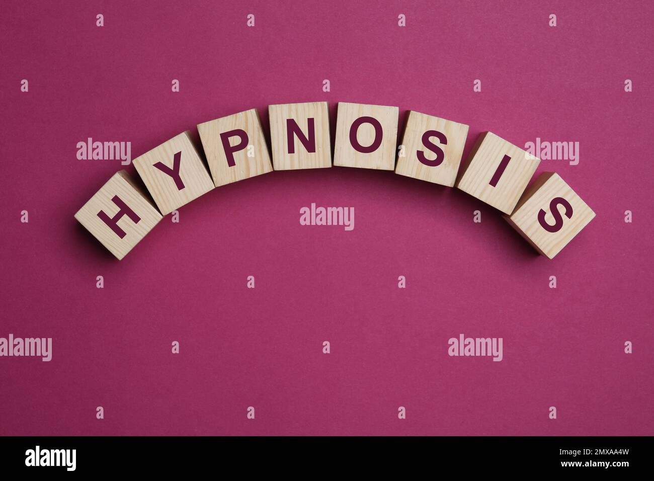 Wooden blocks with word HYPNOSIS on magenta background, flat lay Stock ...