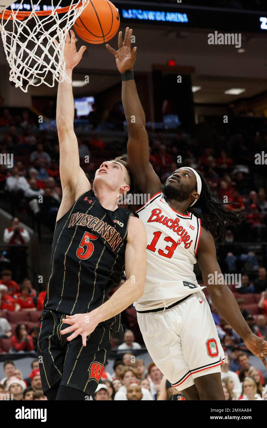 Wisconsin's Tyler Wahl, left, shoots past Ohio State's Isaac Likekele ...