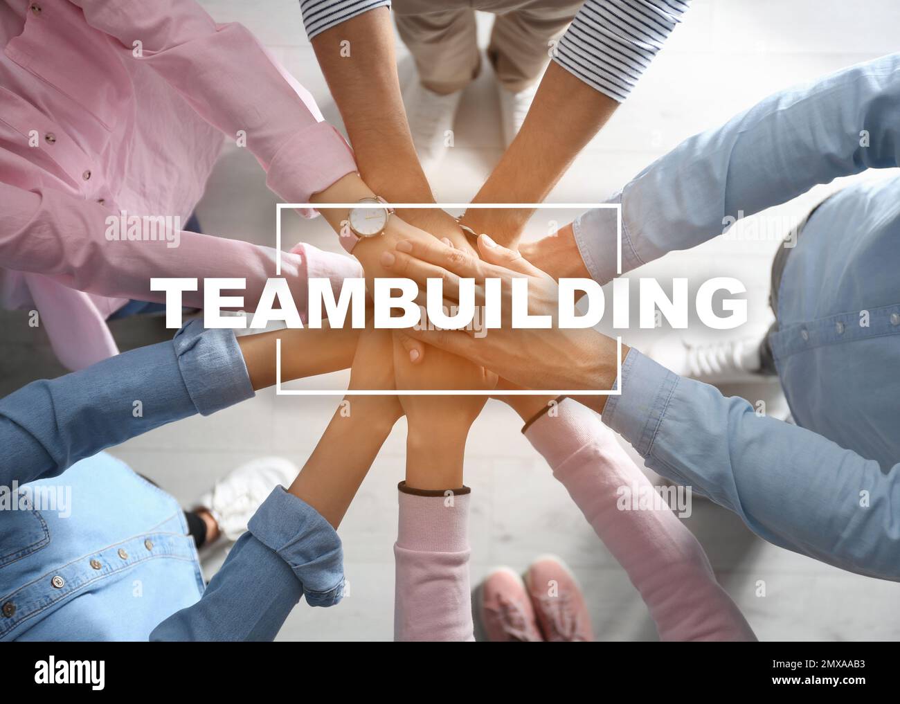 People holding hands together, top view. Teambuilding concept Stock ...