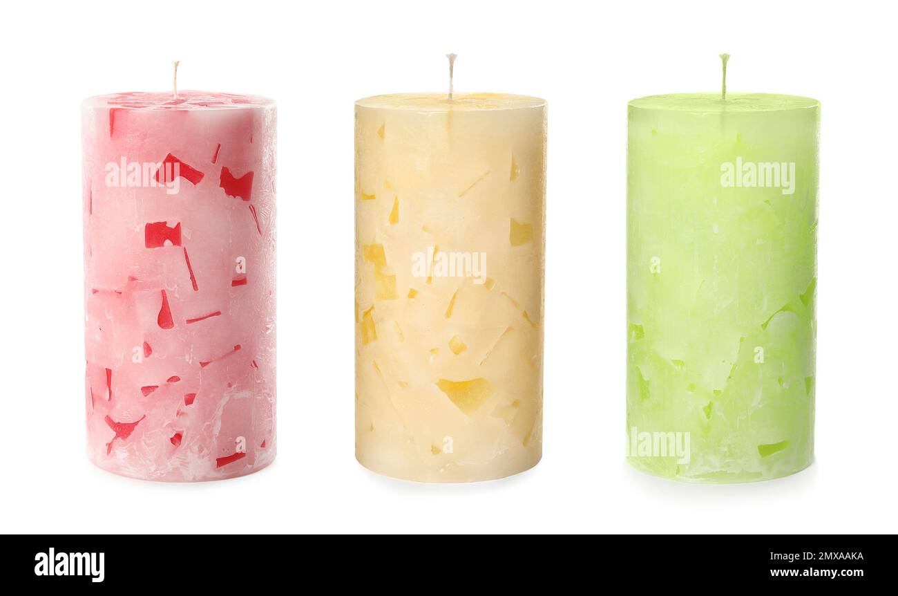 Set of color wax candles on white background Stock Photo - Alamy