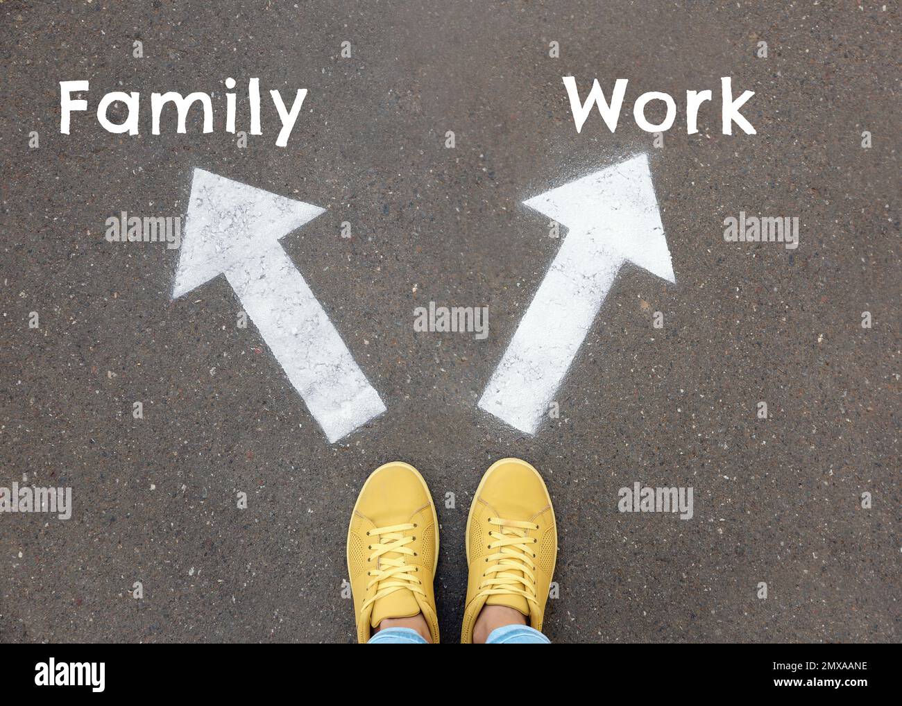 Life choice. Woman on road near arrows with directions to family and ...