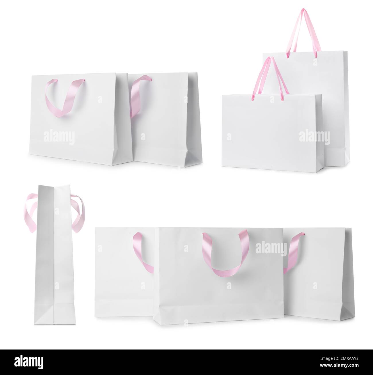 Set with paper shopping bags on white background Stock Photo - Alamy