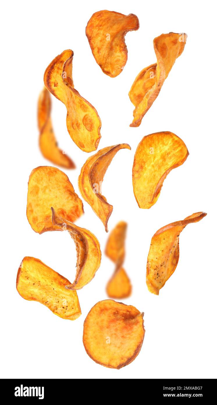 Set of falling sweet potato chips on white background Stock Photo - Alamy