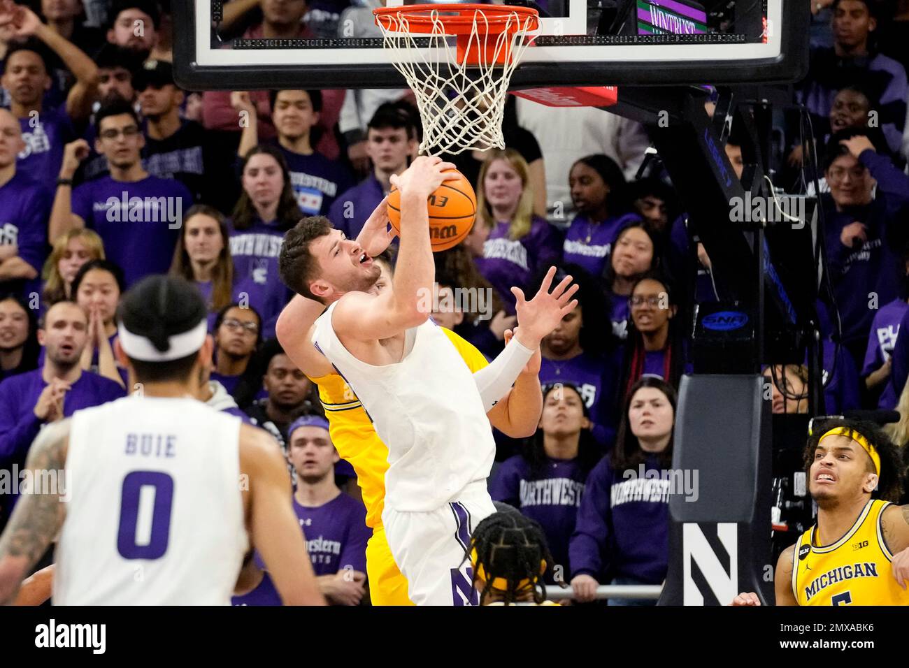 Northwestern forward Robbie Beran, center front, battles for a rebound ...