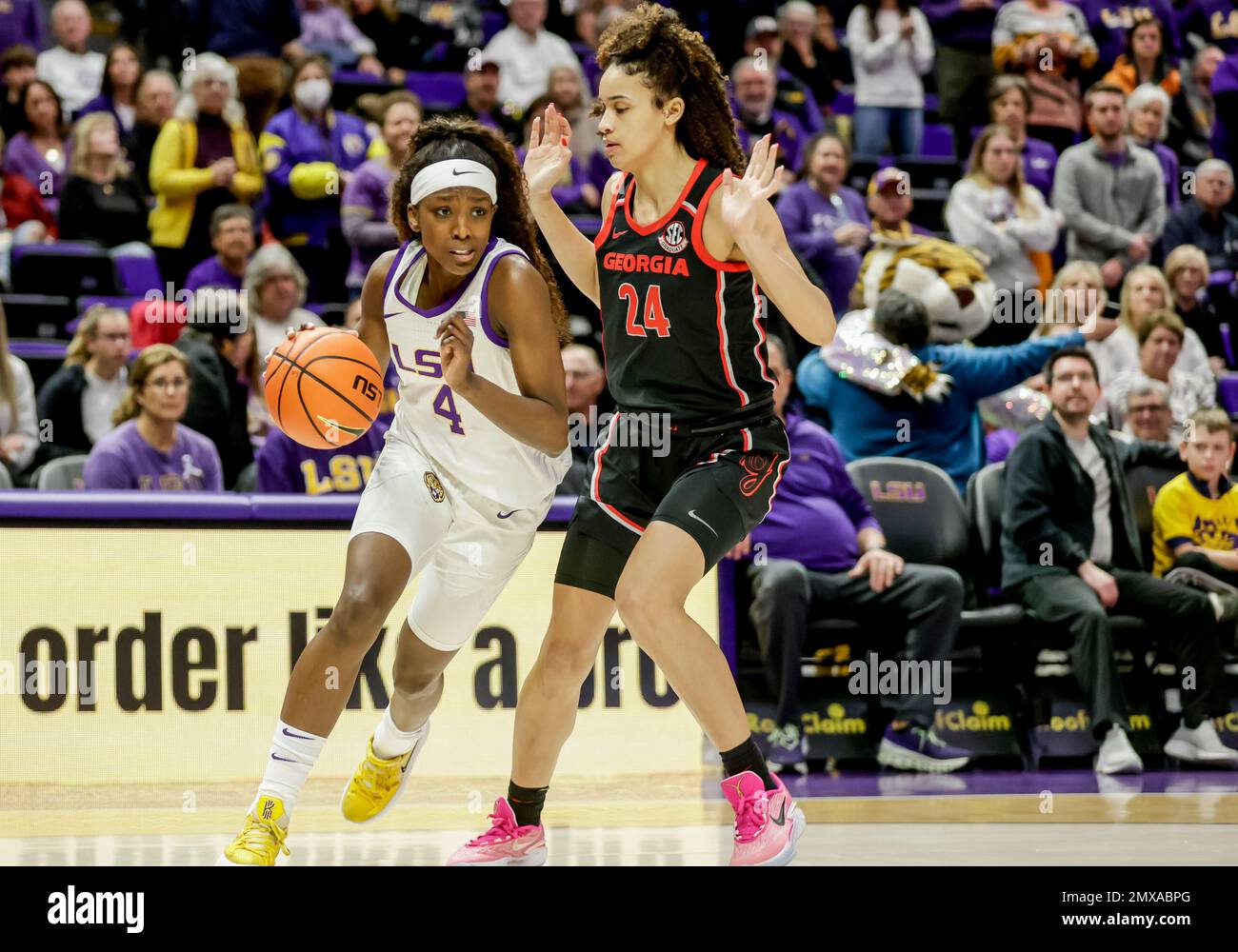 LSU guard Flau'jae Johnson (4) drives past Georgia forward Brittney ...