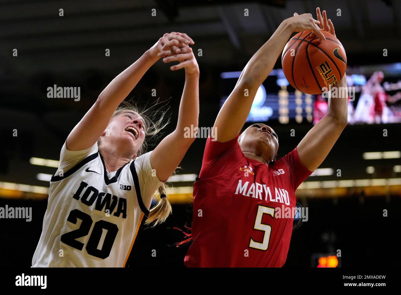 Iowa guard Kate Martin (20) fights for a rebound with Maryland guard ...