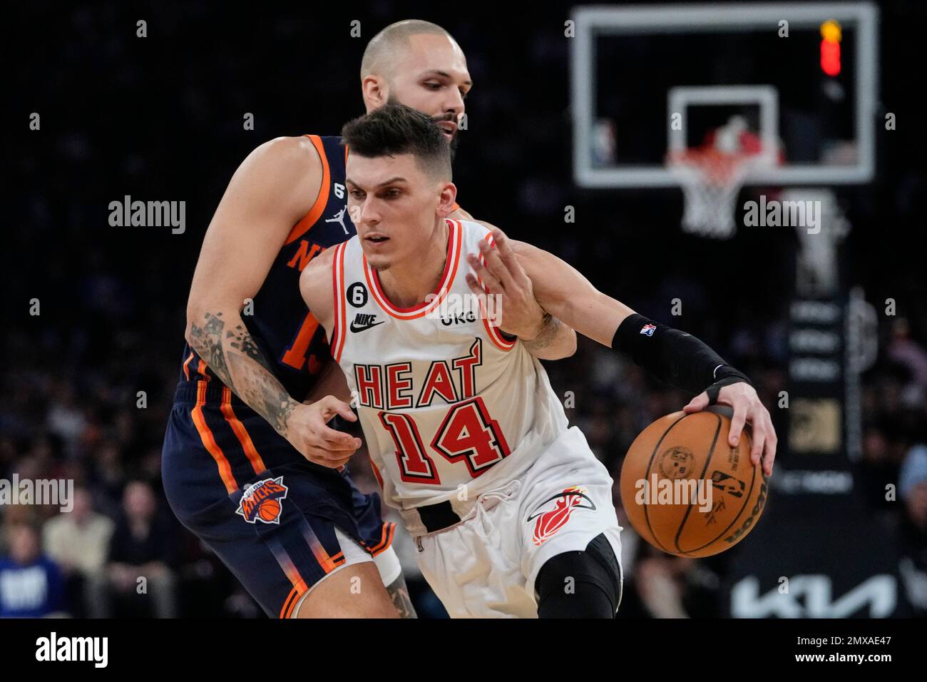 Miami Heat's Tyler Herro, right, drives past New York Knicks' Evan ...