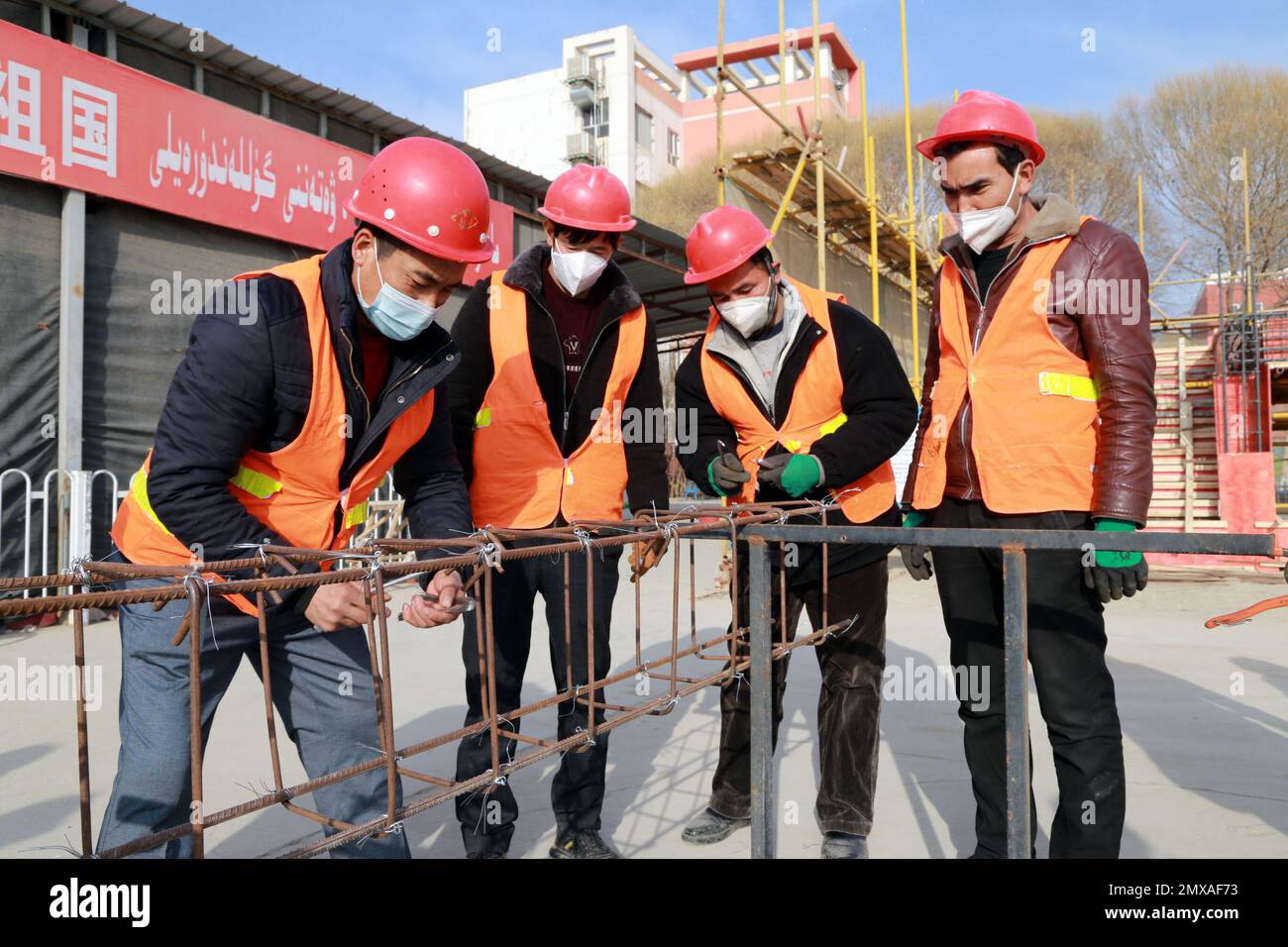 AKSU, CHINA - FEBRUARY 2, 2023 - Students learn how to tie steel bars ...