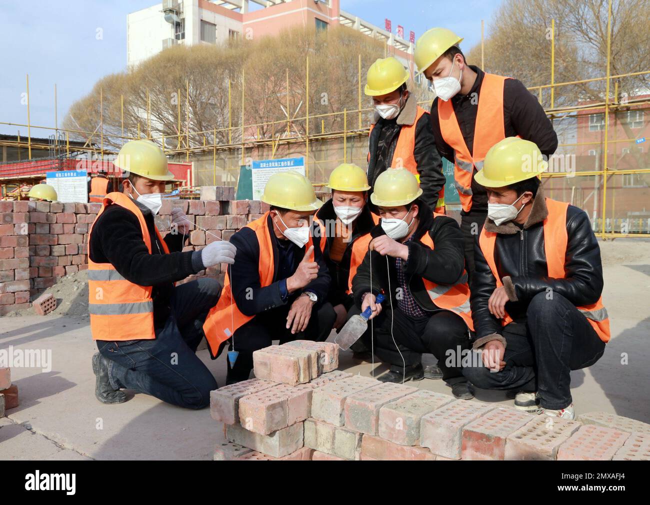 AKSU, CHINA - FEBRUARY 2, 2023 - Students learn bricklaying skills at a ...