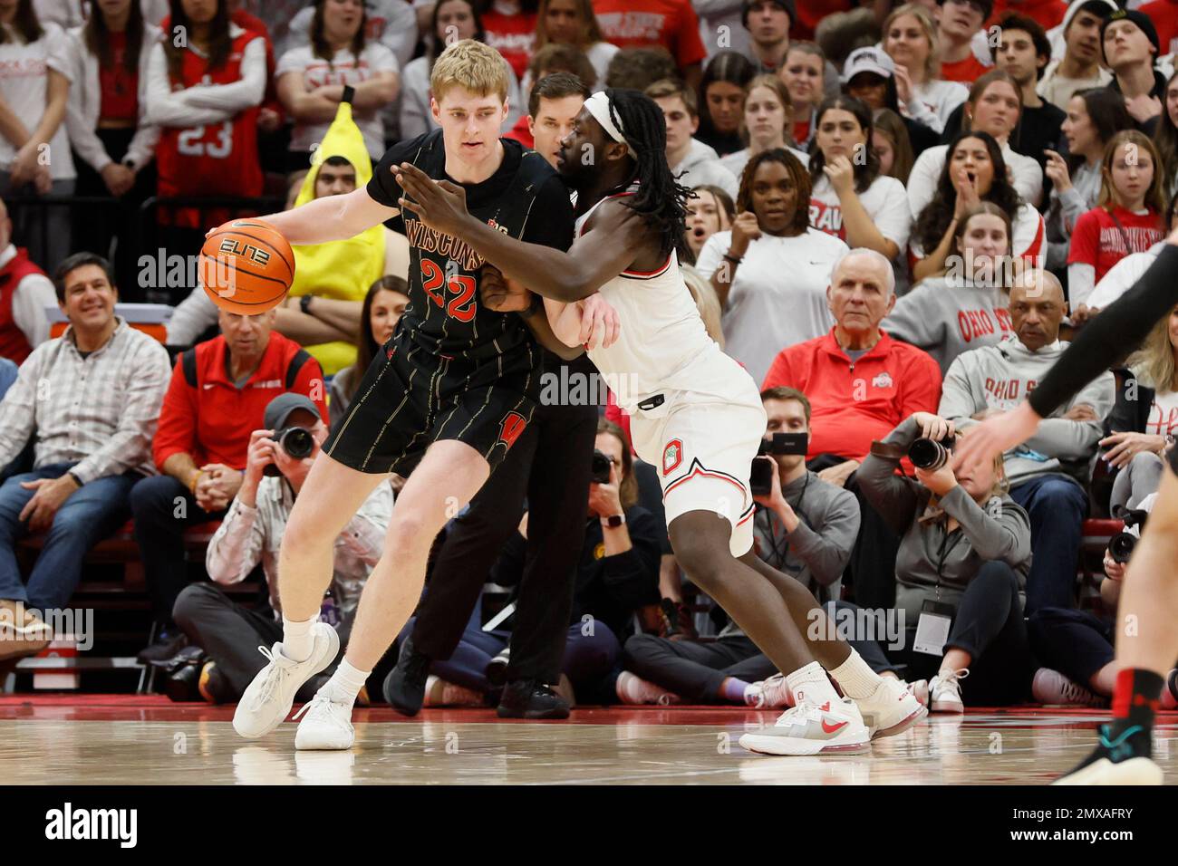 Wisconsin's Steven Crowl, left, tries to dribble around Ohio State's ...