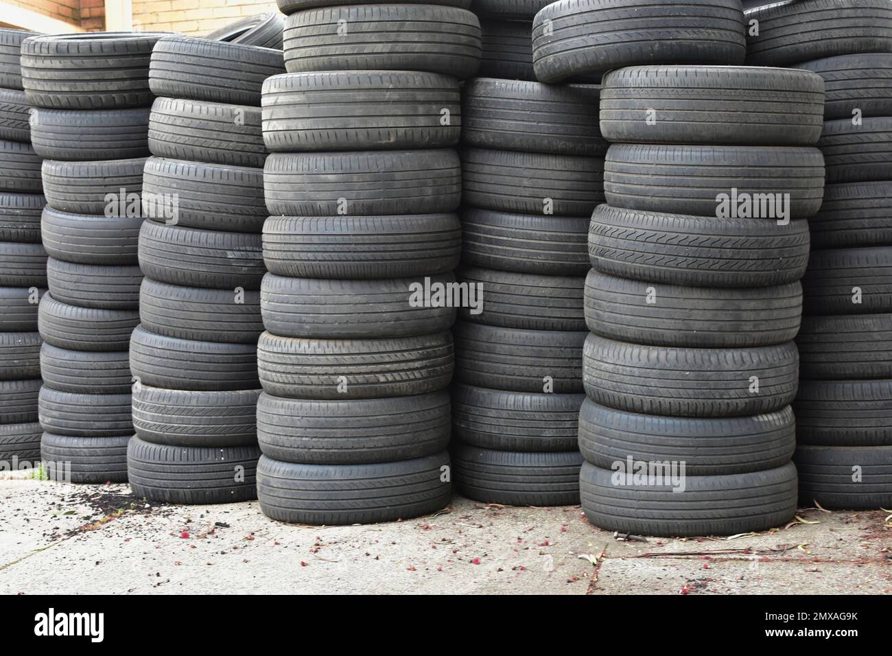 Waste tyres in a pile ready for recycling Stock Photo - Alamy