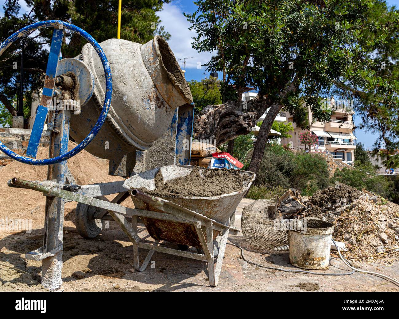 Old cement mixing machine on a construction site, Agios Nikolaos, Crete ...