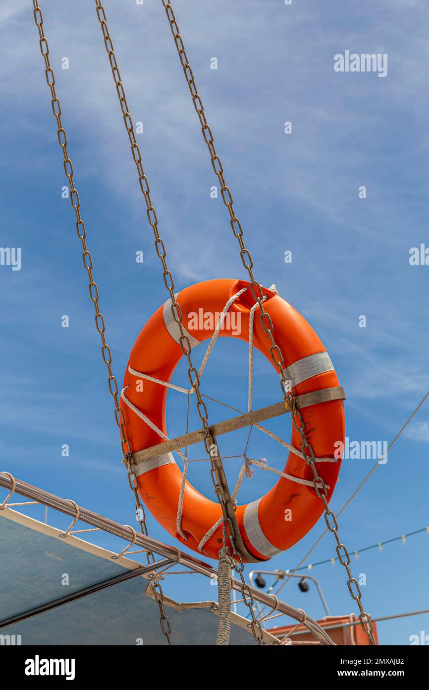 Lifebelt attached to chains on a boat, Crete, Greece Stock Photo - Alamy