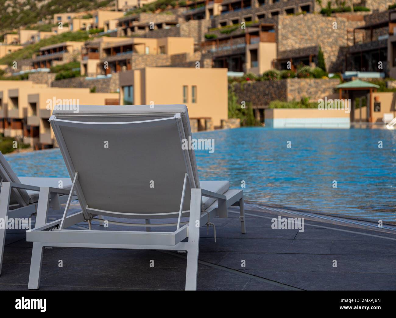 Sun lounger by the swimming pool, Crete, Greece Stock Photo - Alamy