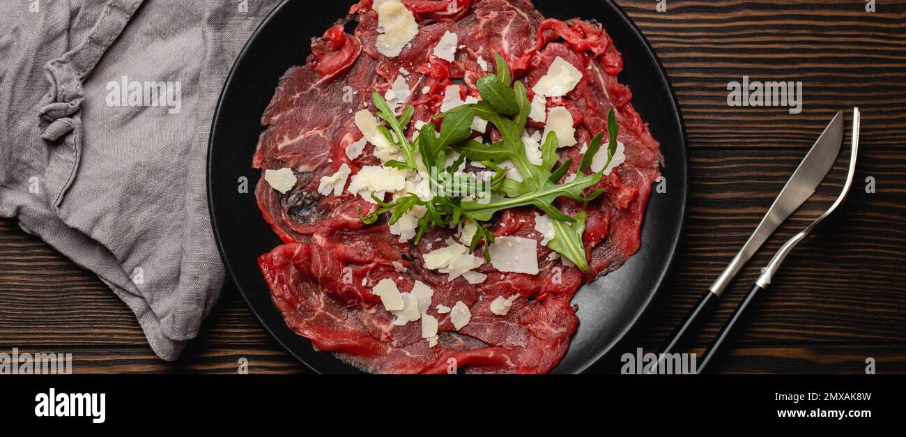 Italian cold meat appetizer Beef carpaccio with parmesan cheese and ...
