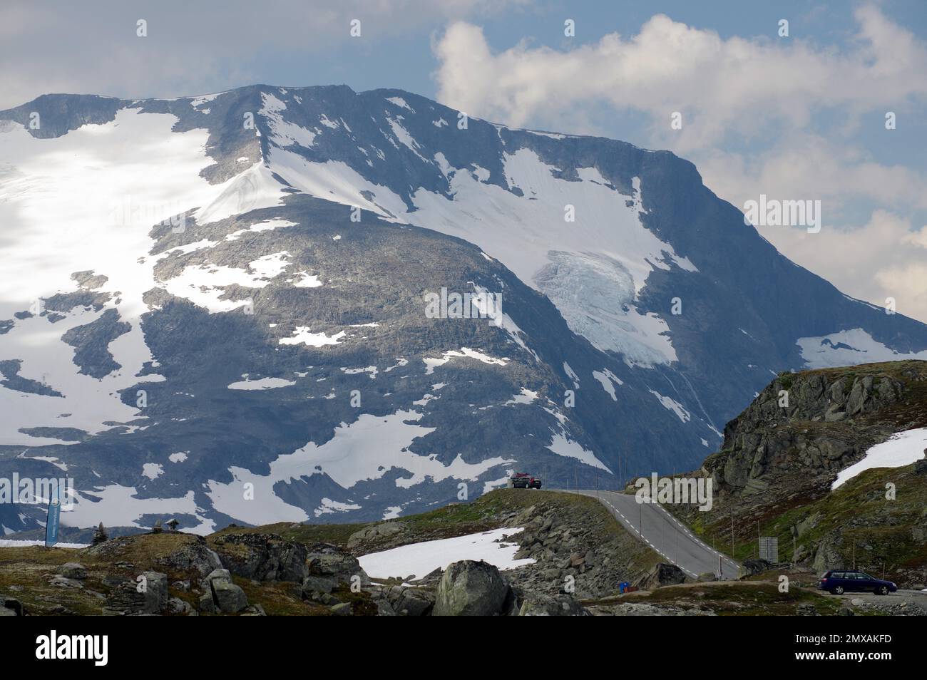 Mountain road in harsh environment with snow, ice and mountains ...