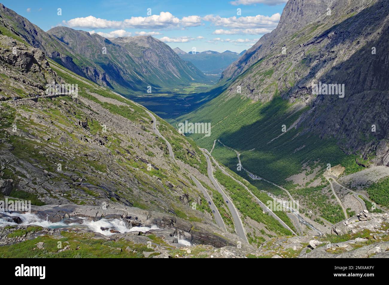 Mountain pass in Zig-Zag serpentines, barren mountains, wild stream ...