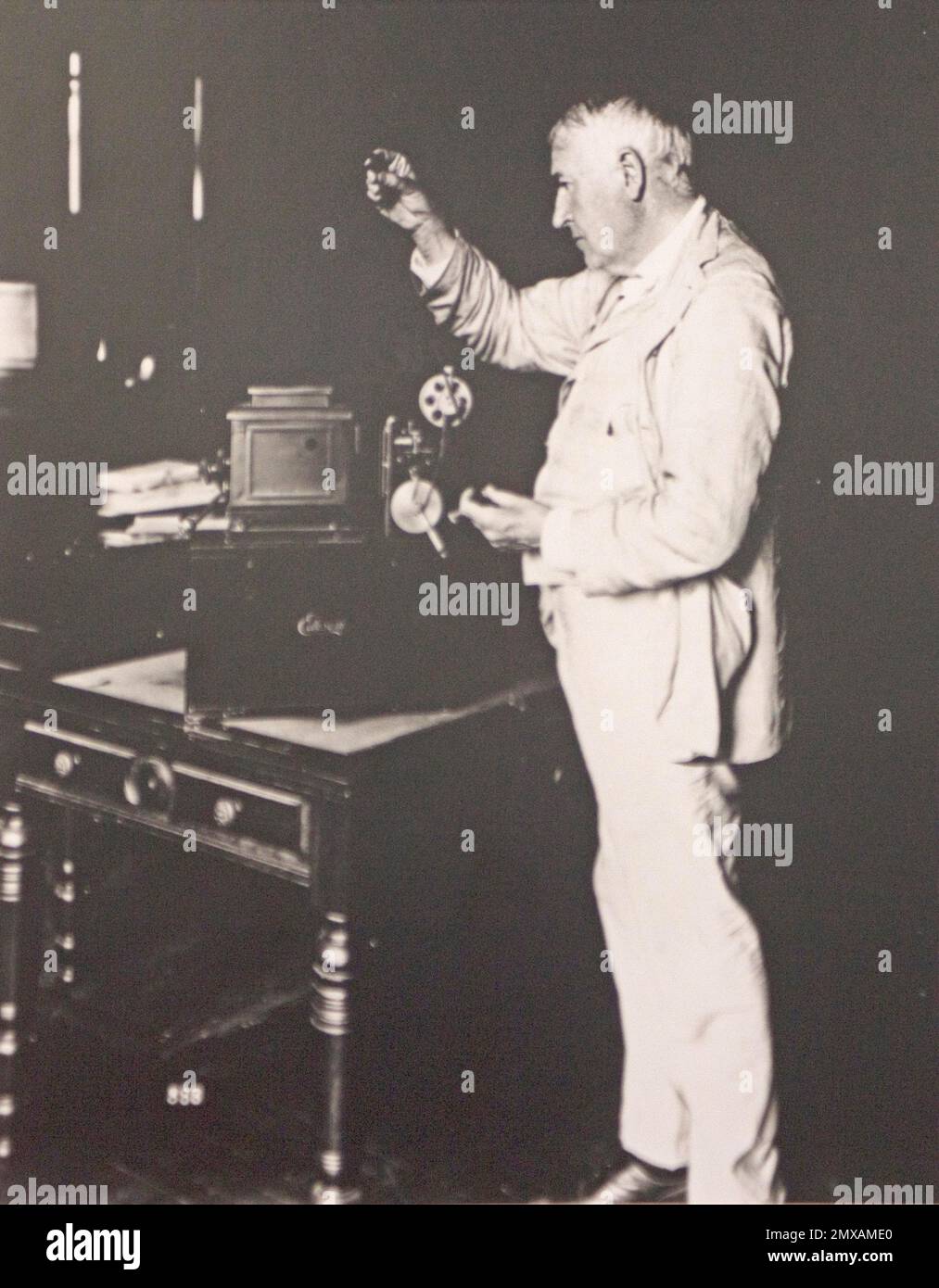 Old black and white photo, Thomas Edison with kinetoscope, 1912, Fort ...