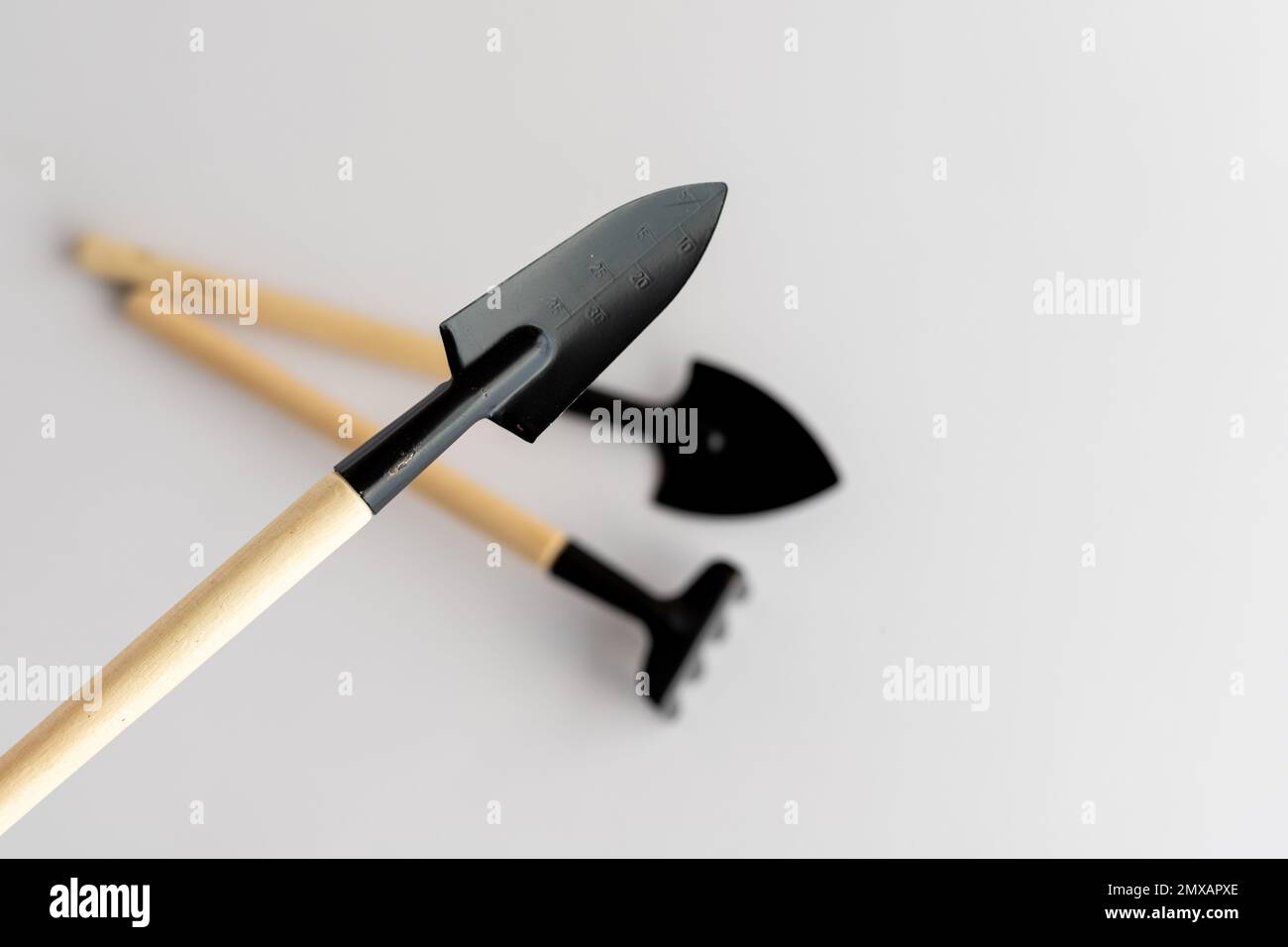 Small shovel on isolated white background Stock Photo - Alamy