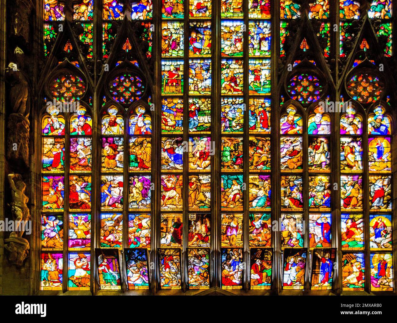 14th century Milan Cathedral stained glass windows in white marble ...