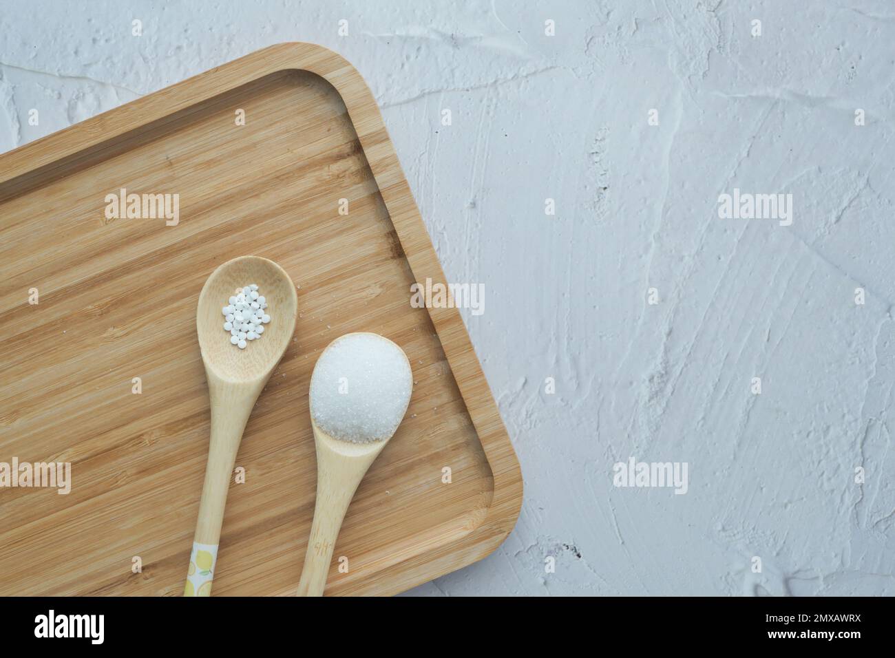 artificial sweetener container on wooden spoon Stock Photo - Alamy
