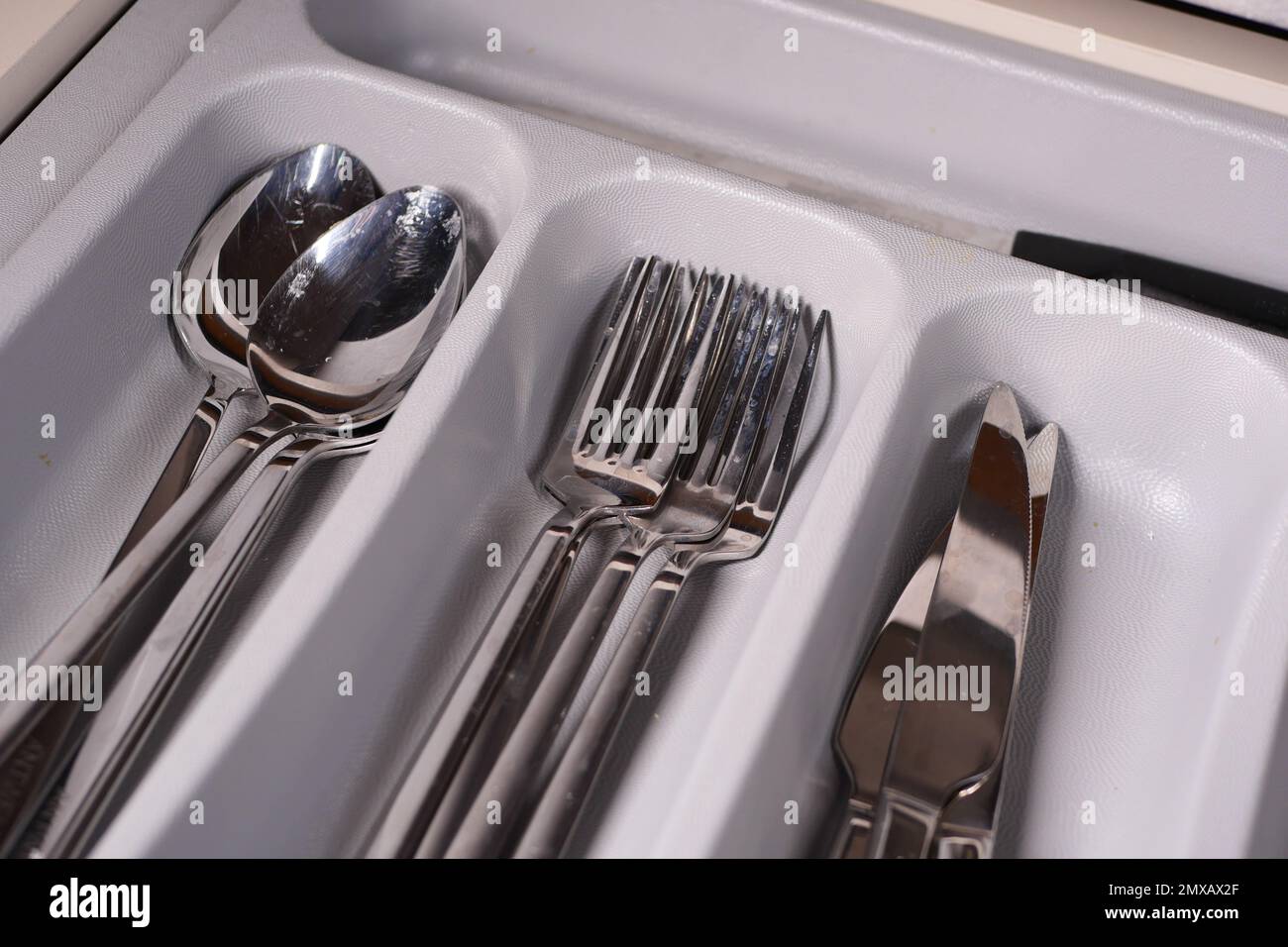 cutlery fork with knife and spoon in a drawer Stock Photo - Alamy