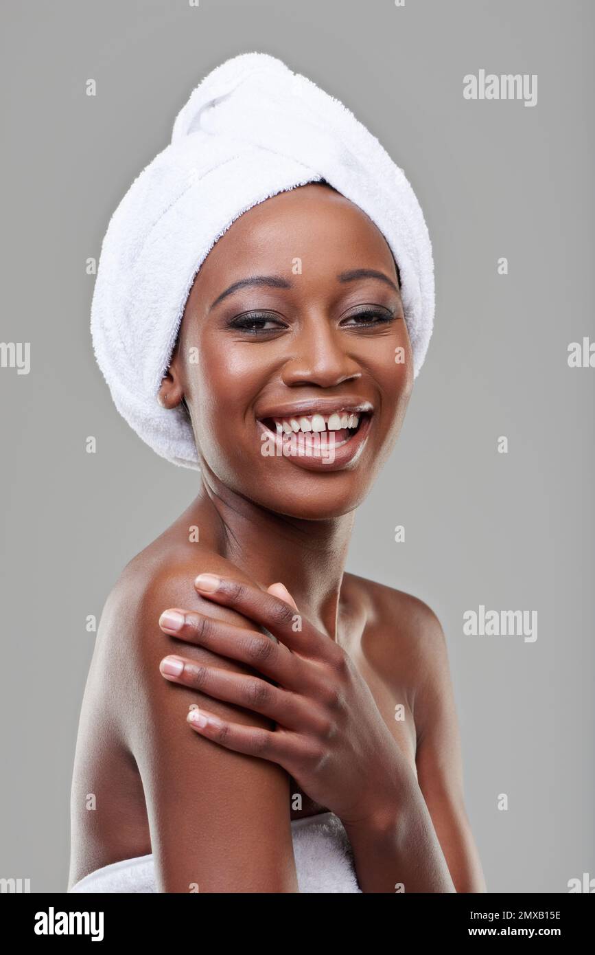 Skin to envy. Studio portrait of a beautiful young woman touching her ...