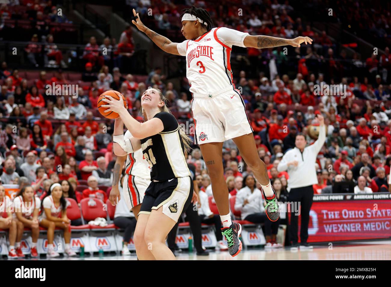 Purdue forward Caitlyn Harper, left, shoots in front of Ohio State ...