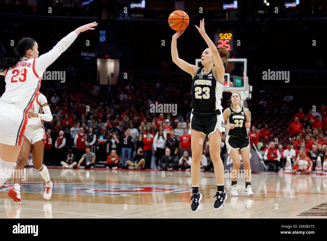 Purdue guard Abbey Ellis, right, shoots in front of Ohio State forward ...