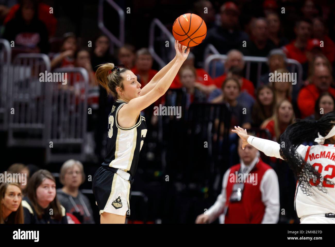 Purdue guard Abbey Ellis, left, shoots behind Ohio State forward Cotie ...