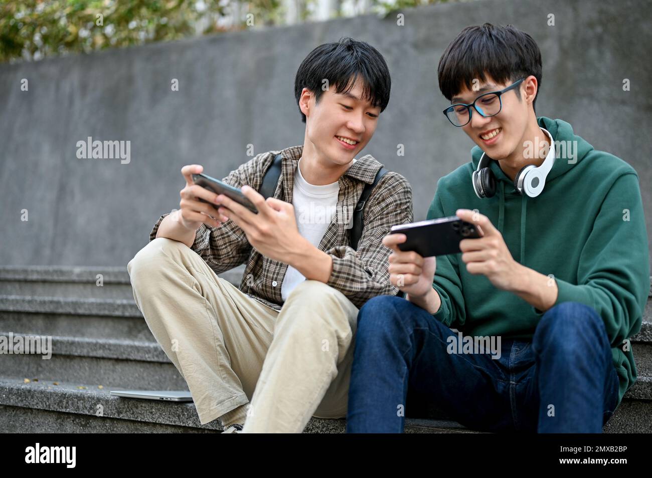 Asian male teenager playing game hi-res stock photography and images ...