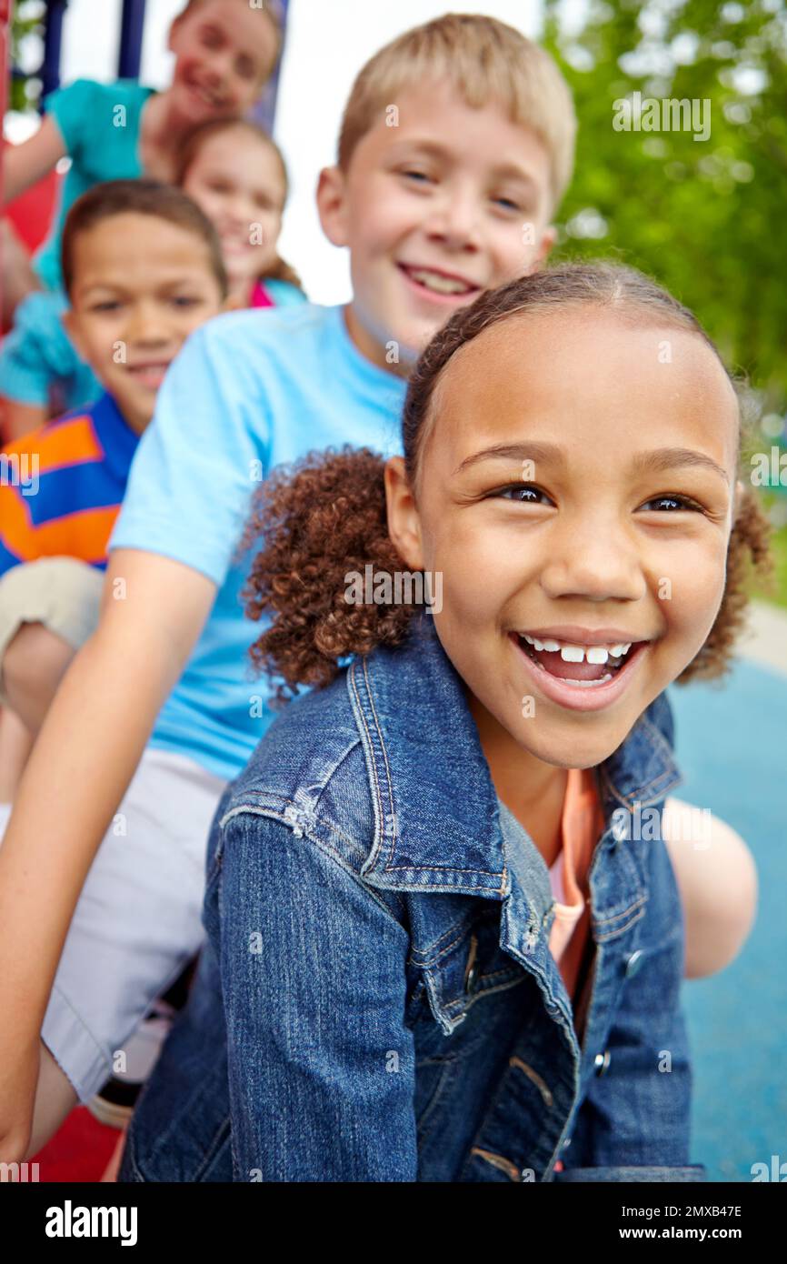 Adorable friends. A happy group of multi-ethnic children sitting ...