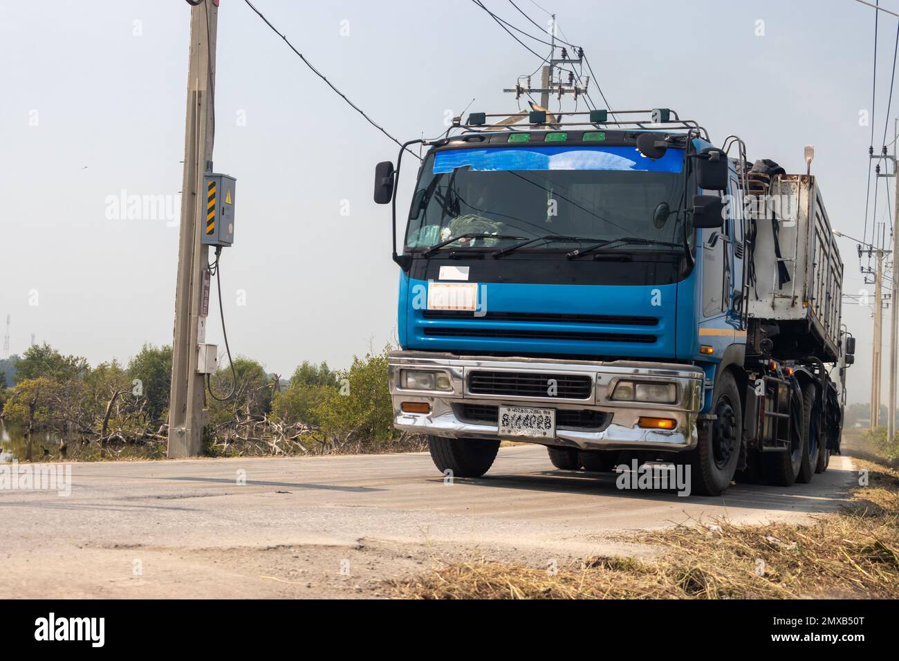 A truck drives on the rural road, front view Stock Photo - Alamy