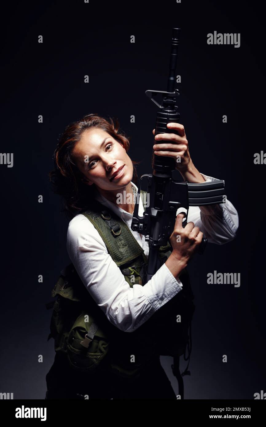 Powerful stance. Portrait of a woman wearing a safety jacket while ...