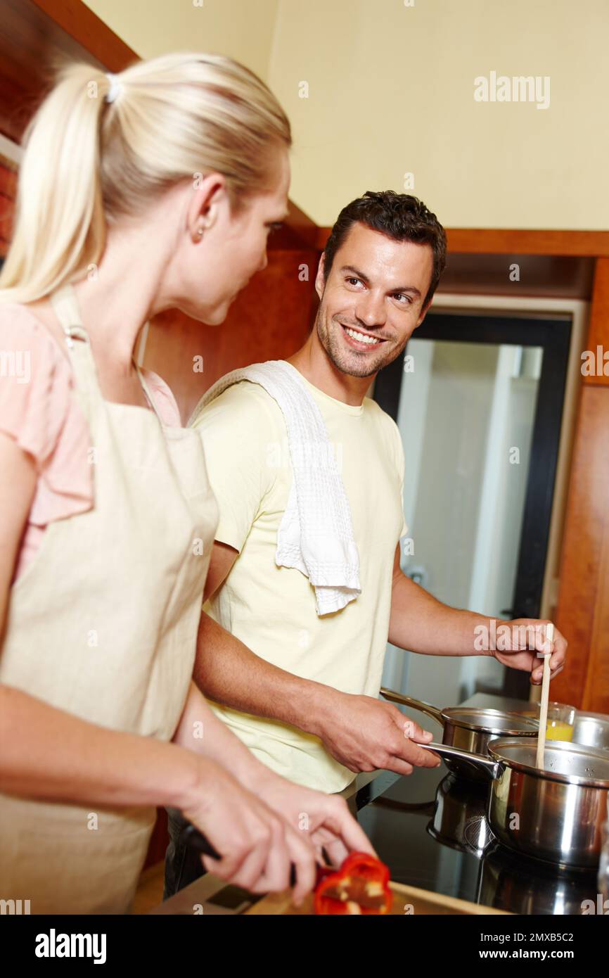 Cooking together creates a special bond. A husband and wife cooking ...