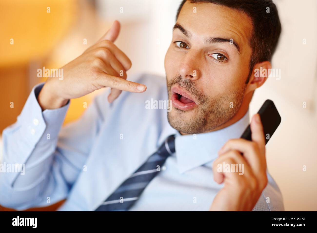 Call me with your business queries. A young businessman making the call ...