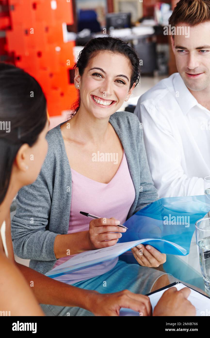 I love collaborating with my colleagues. Portrait of a beautiful young ...