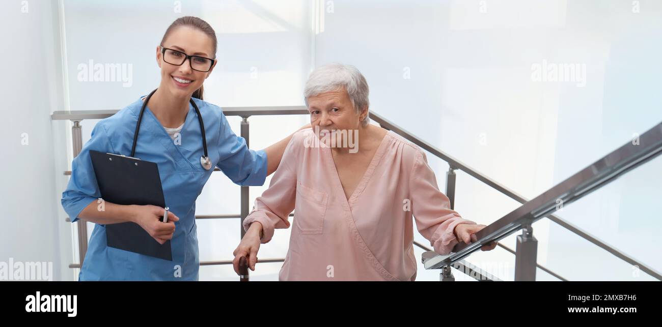 Doctor helping senior patient in modern hospital. Banner design Stock ...
