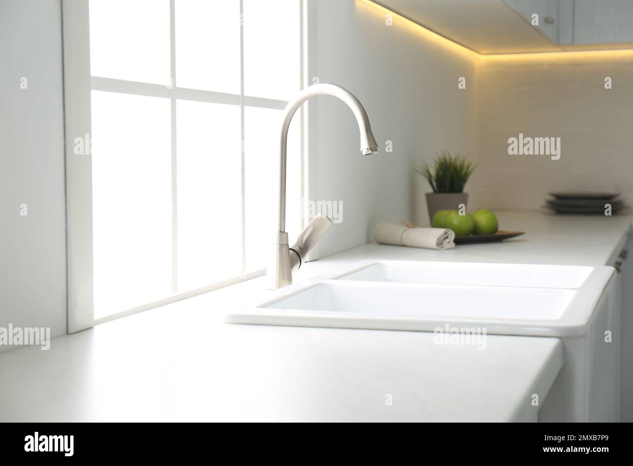 New ceramic sink and modern tap in stylish kitchen interior Stock Photo ...