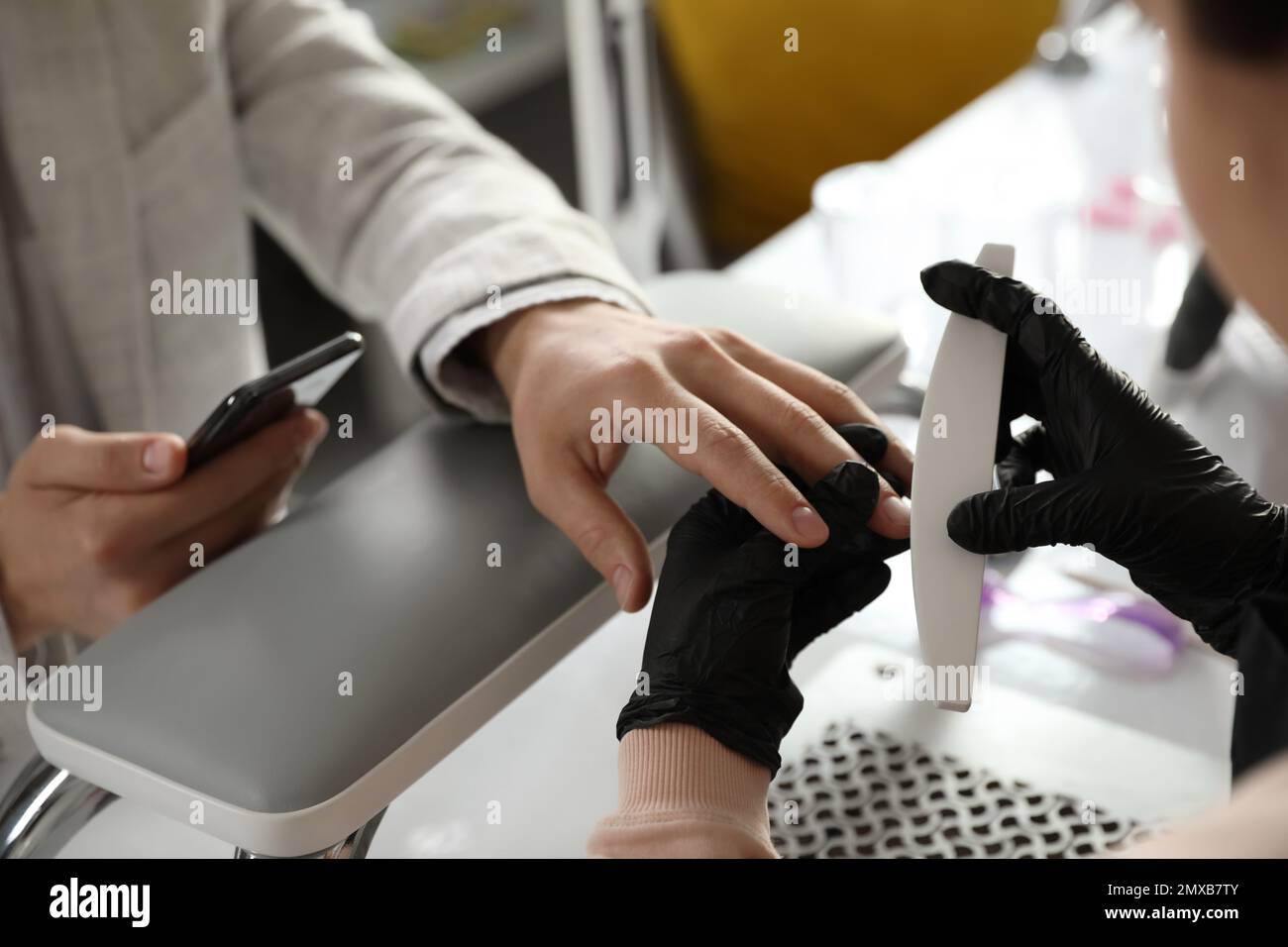 Female hands filing nails hi-res stock photography and images - Alamy